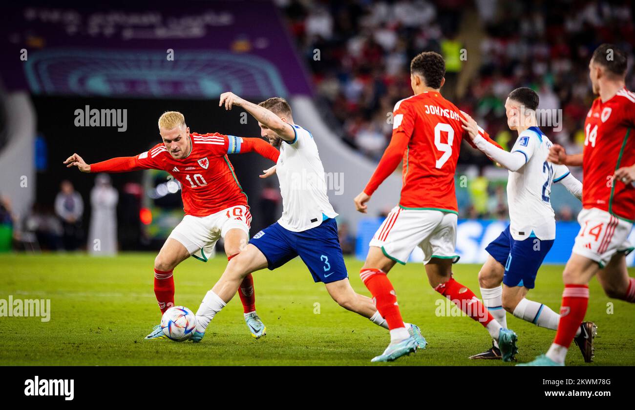 Doha, Qatar. 29th Nov, 2022. Aaron Ramsey (Wales), Luke Shaw (England ...