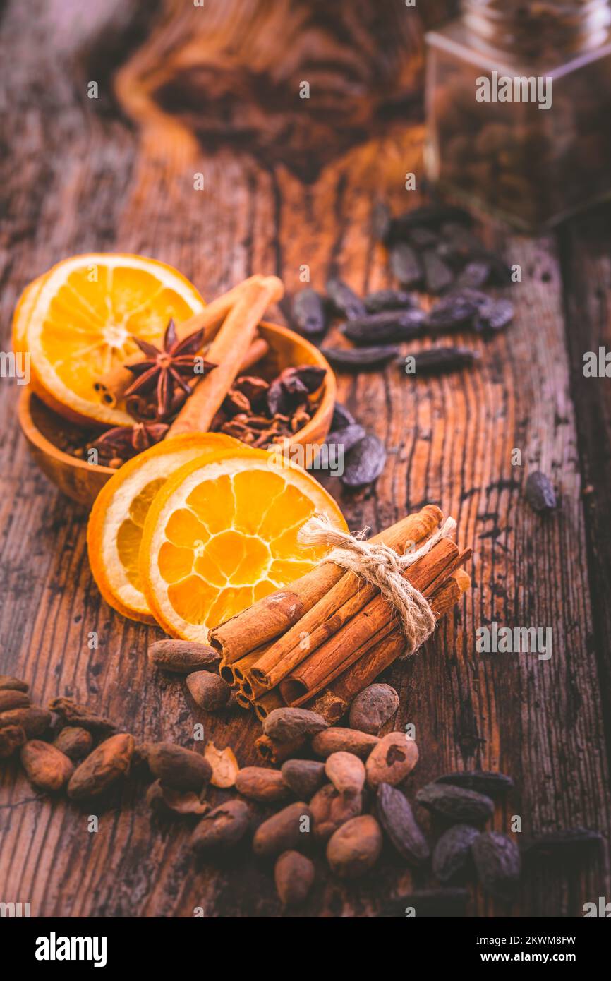 Variation of Christmas spices, dried orange, cocoa and tonka beans on ...