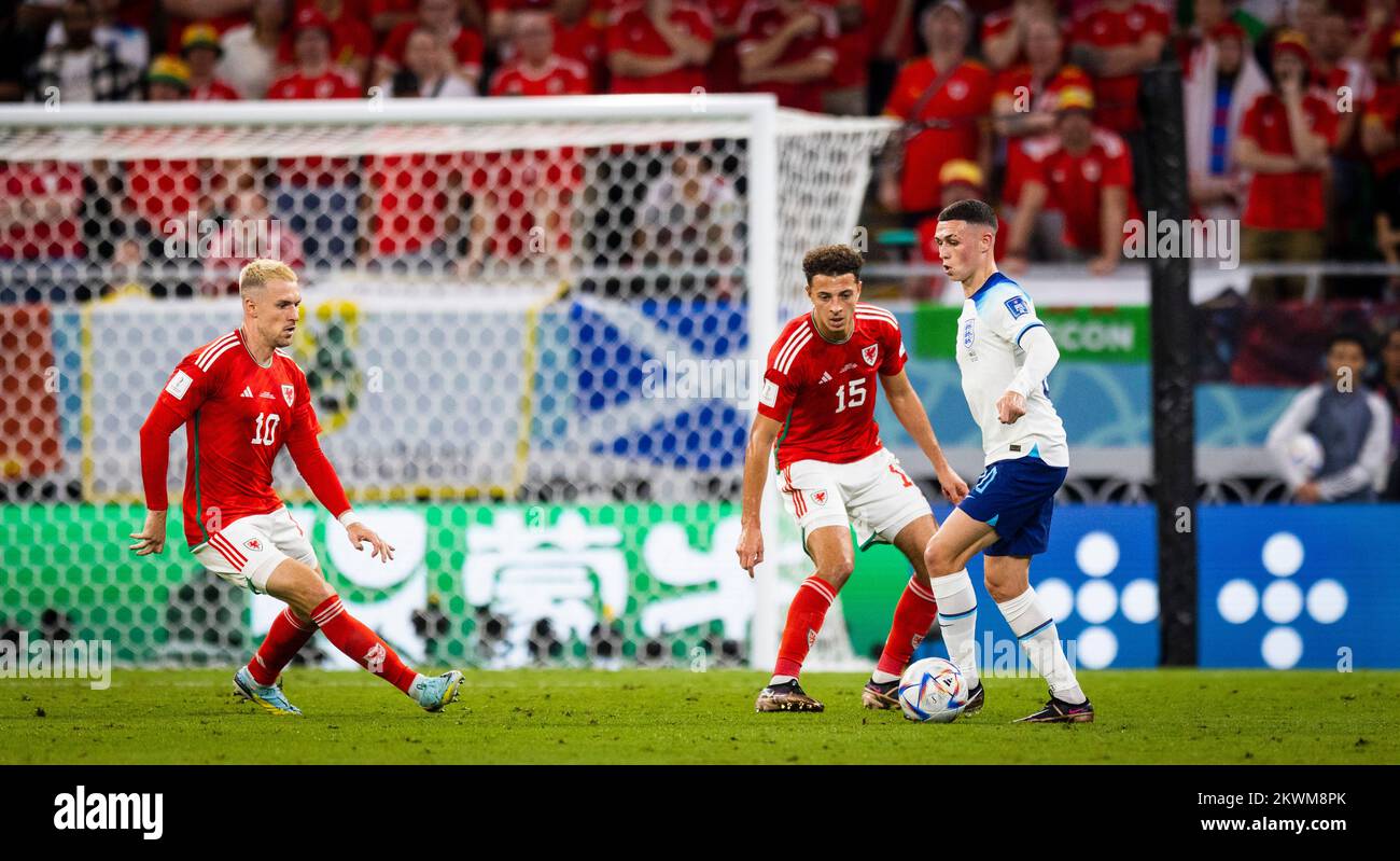 Doha, Qatar. 29th Nov, 2022. Phil Foden (England), Aaron Ramsey (Wales ...