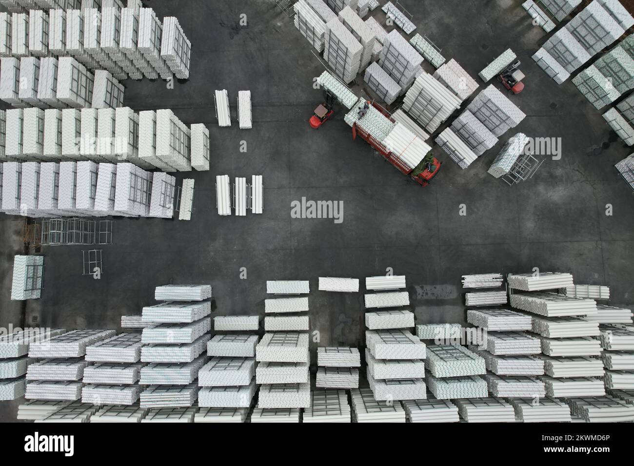 Workers are producing PVC pipes in a plastic products factory in ...