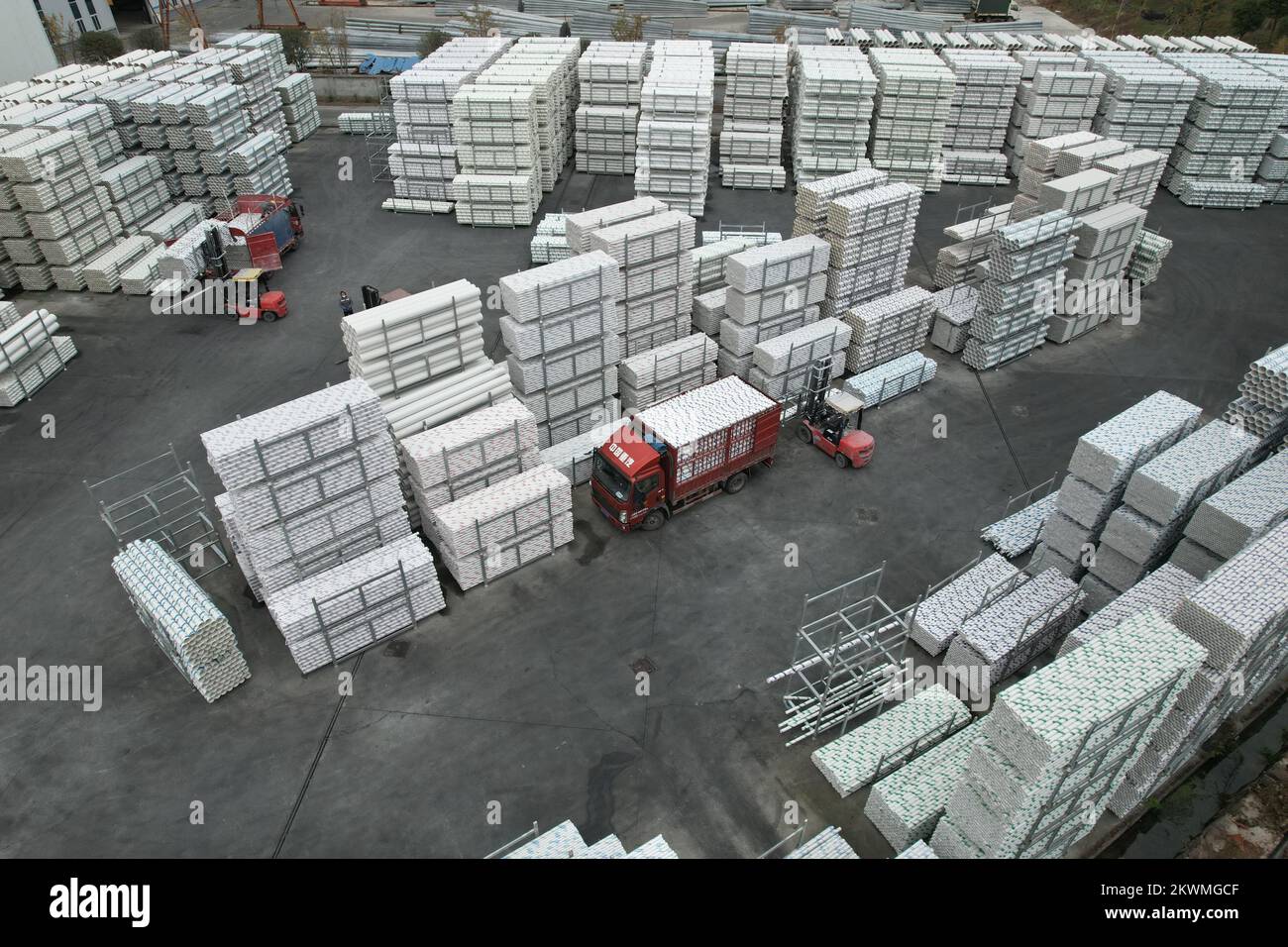 Workers are producing PVC pipes in a plastic products factory in ...