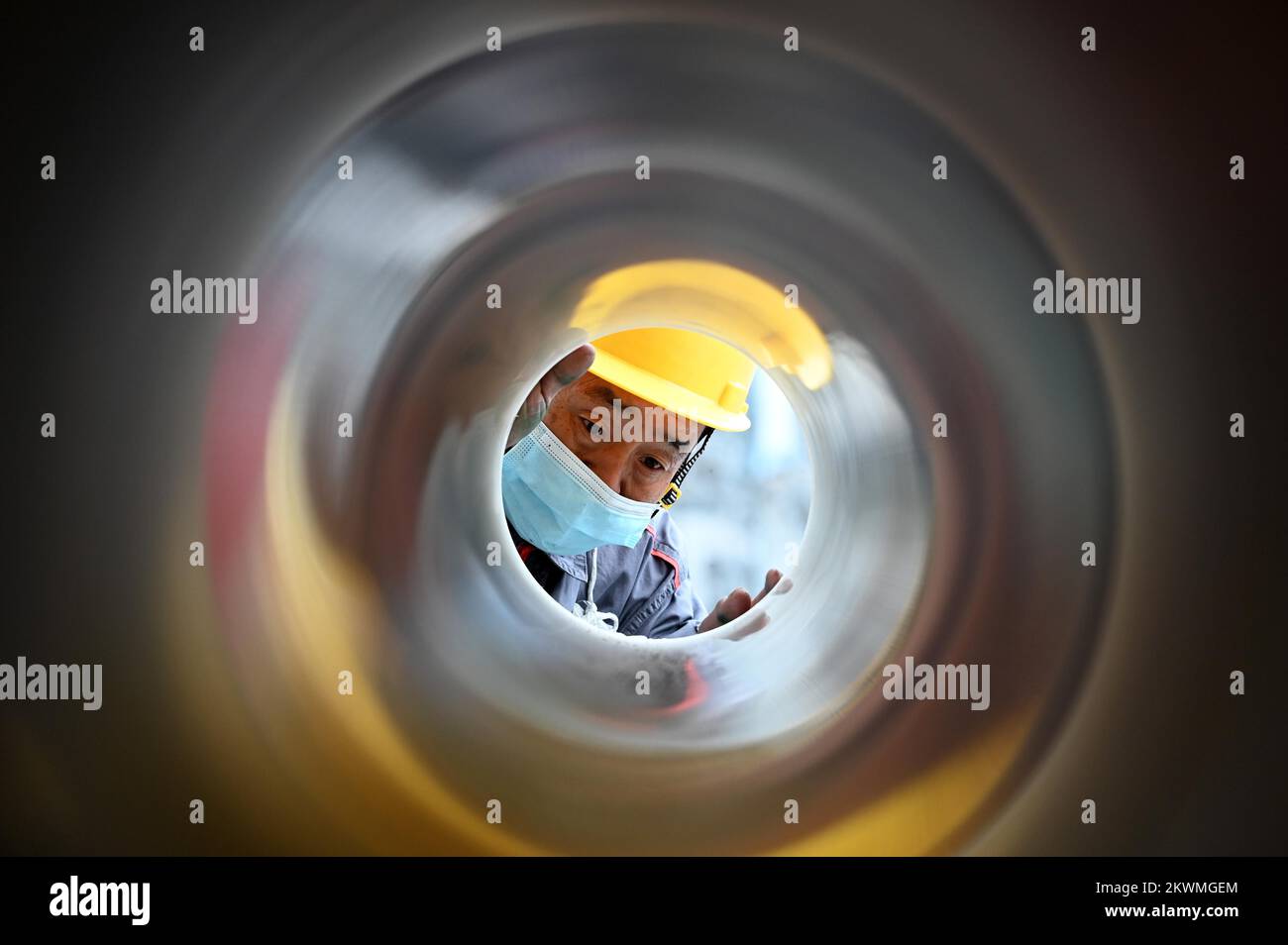 Workers are producing PVC pipes in a plastic products factory in ...