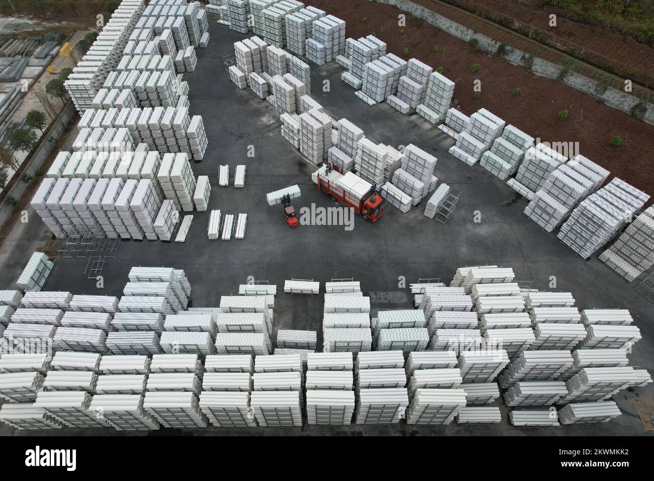 Workers are producing PVC pipes in a plastic products factory in ...