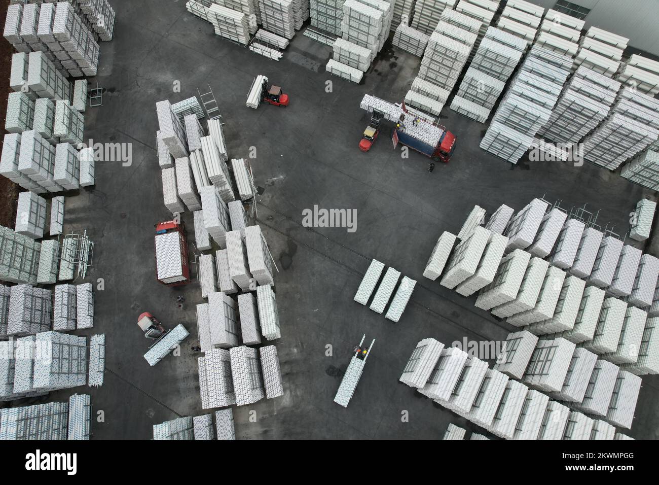 Workers are producing PVC pipes in a plastic products factory in ...