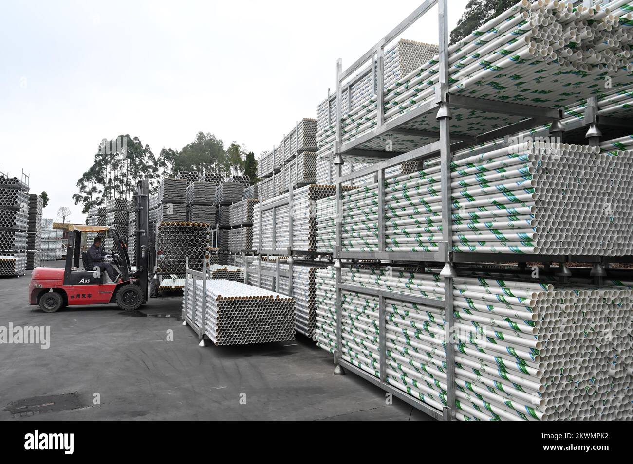Workers are producing PVC pipes in a plastic products factory in ...