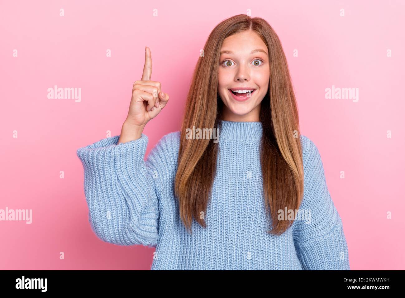 Photo of funny excited school teenage girl brown hair wear blue knit ...