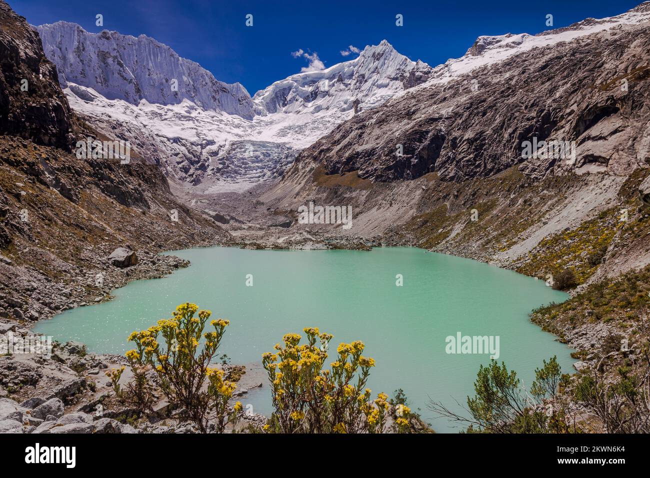 Llaca lake in Cordillera Blanca with snowcapped Andes, Ancash, Peru ...