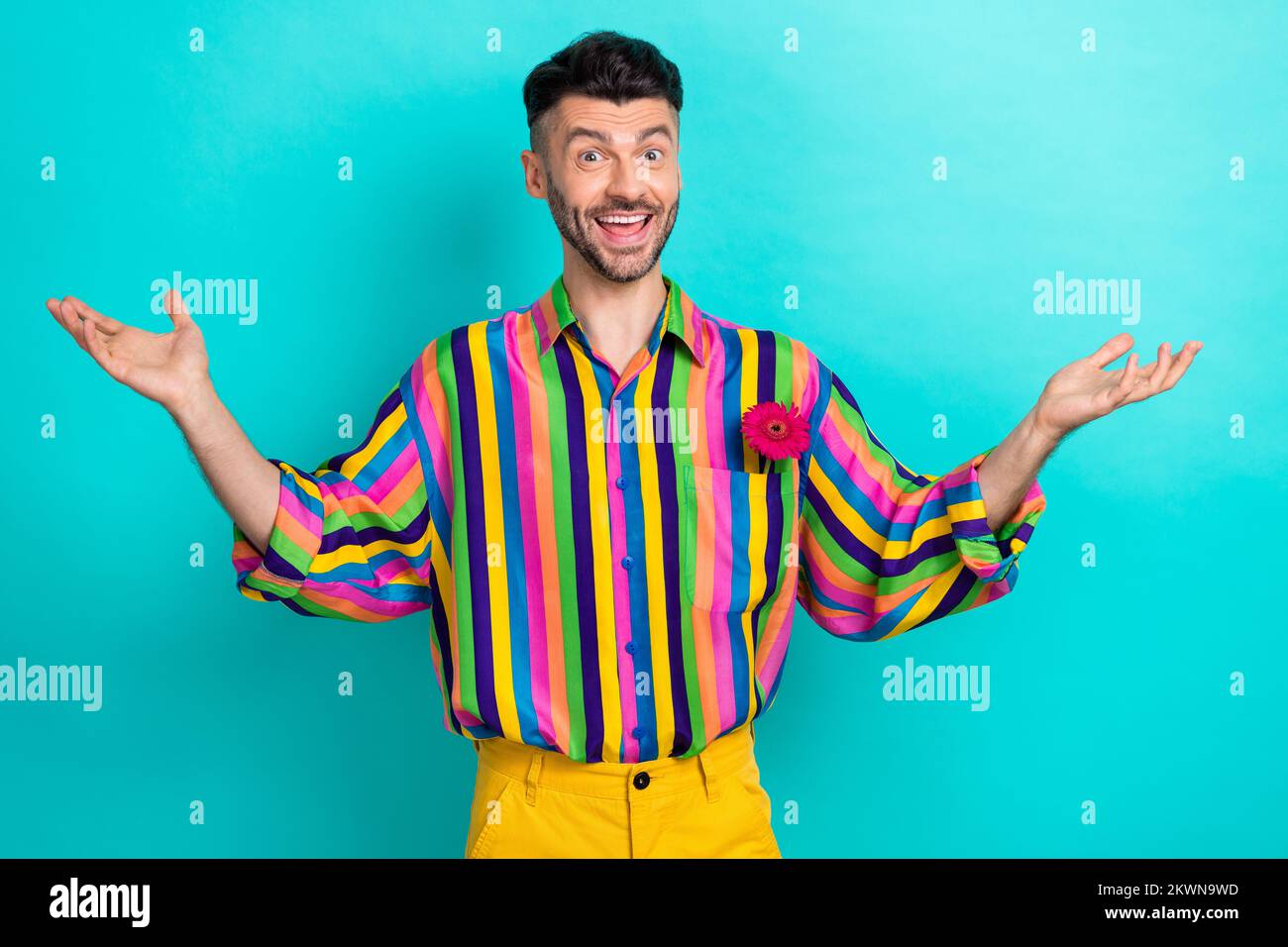 Photo of cheerful person toothy smile raise arms daisy flower shirt ...