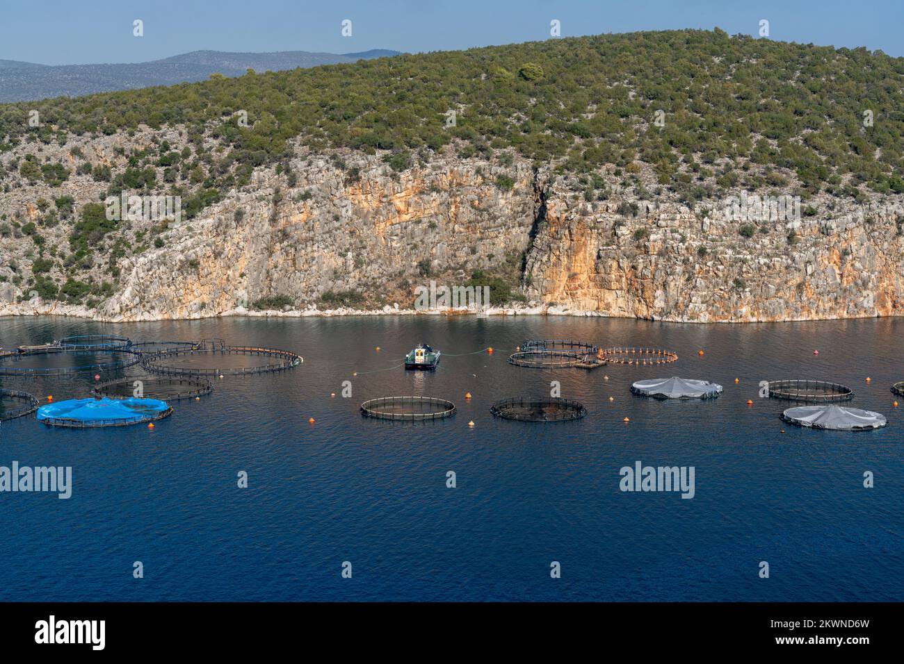 A small ocean cove on the coast of the Peloponnese in Greece with ...