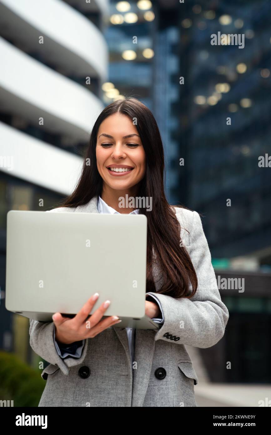 Beautiful business professional woman in the city outdoor. Business ...