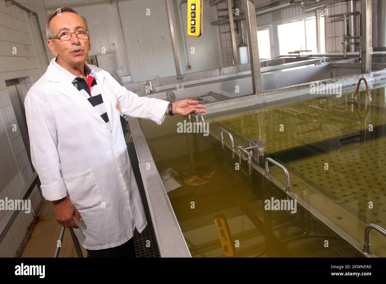 14.08.2013., Kolan, island Pag , Croatia - Ivan Gligora and and his son ...