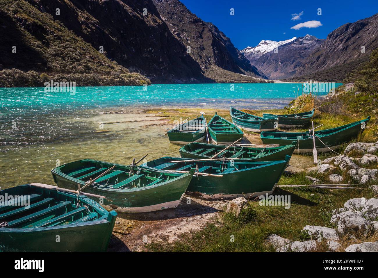 Llanganuco lake with boats in Cordillera Blanca, snowcapped Andes ...