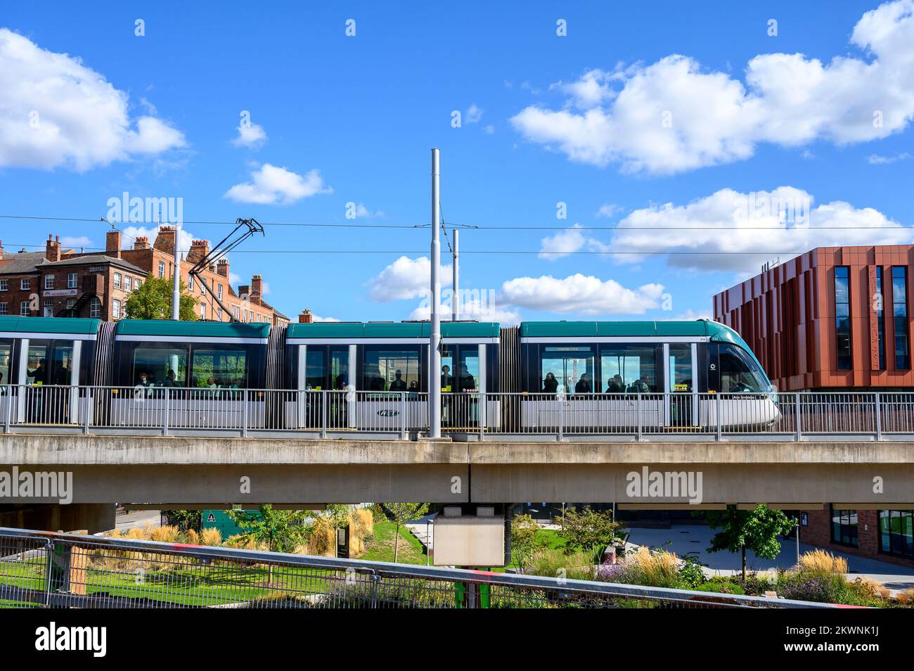 Nottingham Express Transit tram crossing a bridge in Nottingham city ...