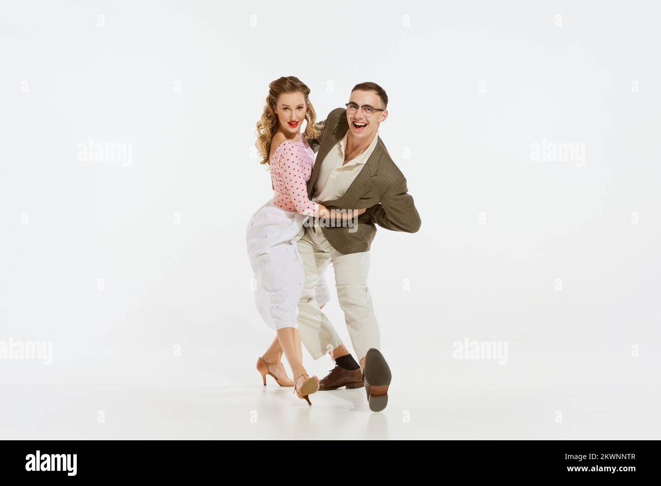 Young excited man and woman in 60s american fashion style clothes ...