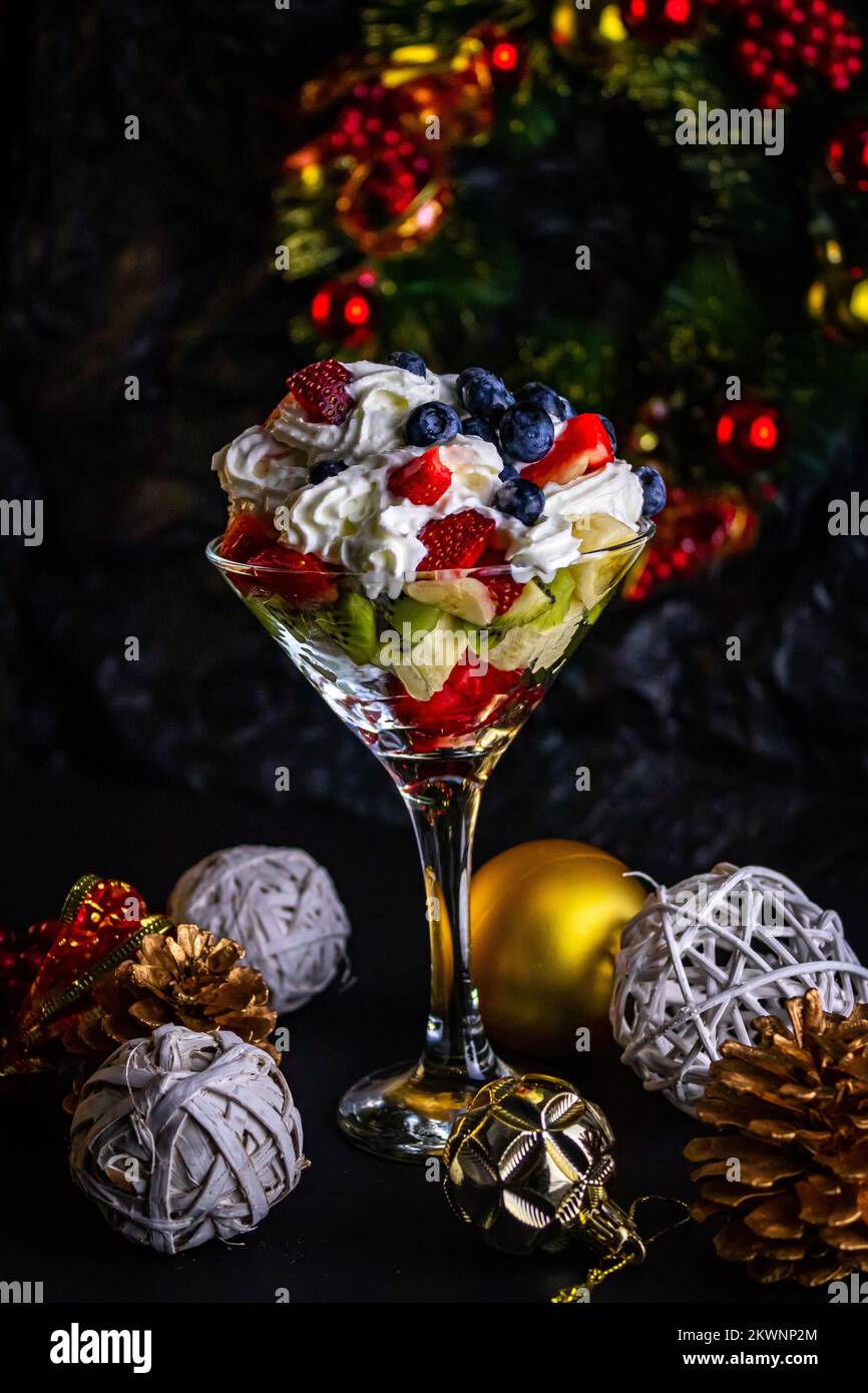 fruit salad in a beautiful glass decorated with cream Stock Photo - Alamy