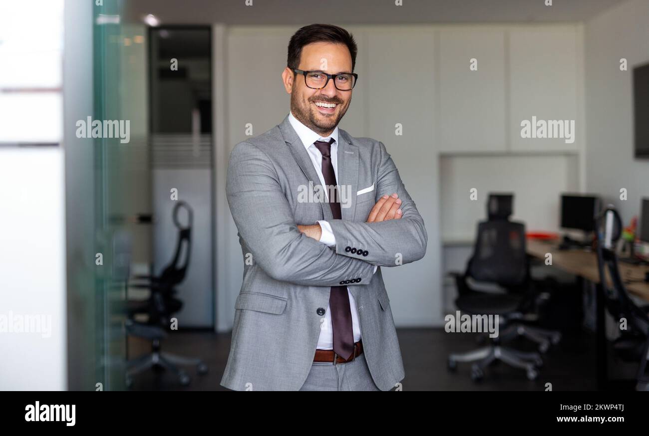 Portrait of young successful ceo businessman smiling in corporate ...