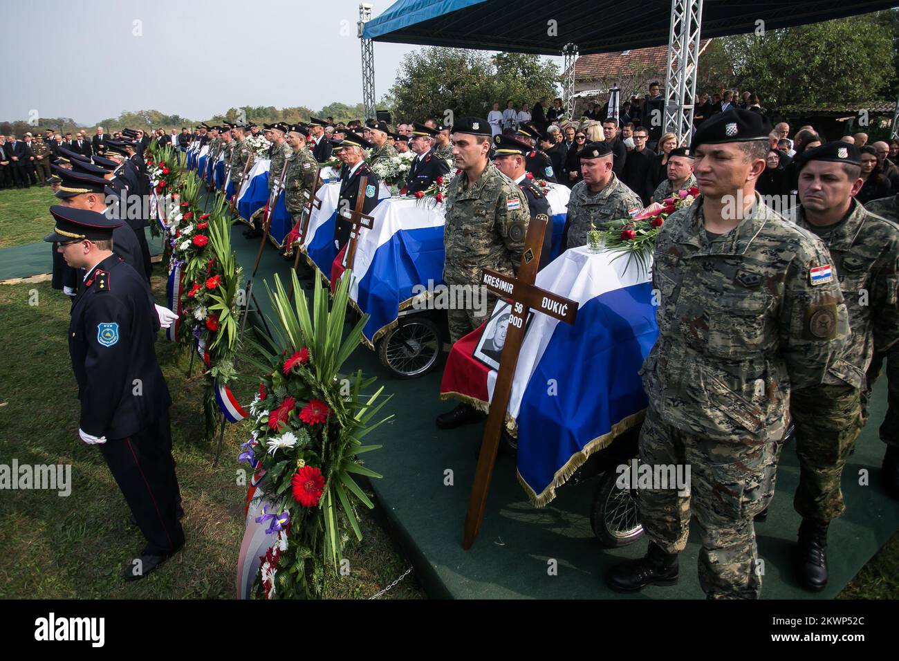 14.10.2013., Sotin, Croatia - Joint funerals of body remains of four ...