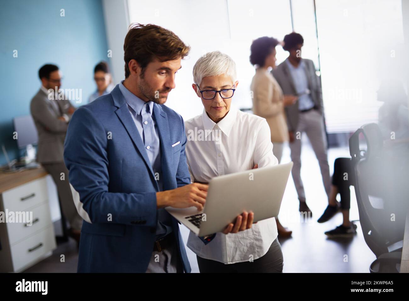 Group of multiethnic successful business people working and ...