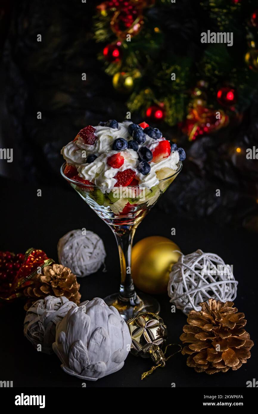fruit salad in a beautiful glass decorated with cream Stock Photo - Alamy