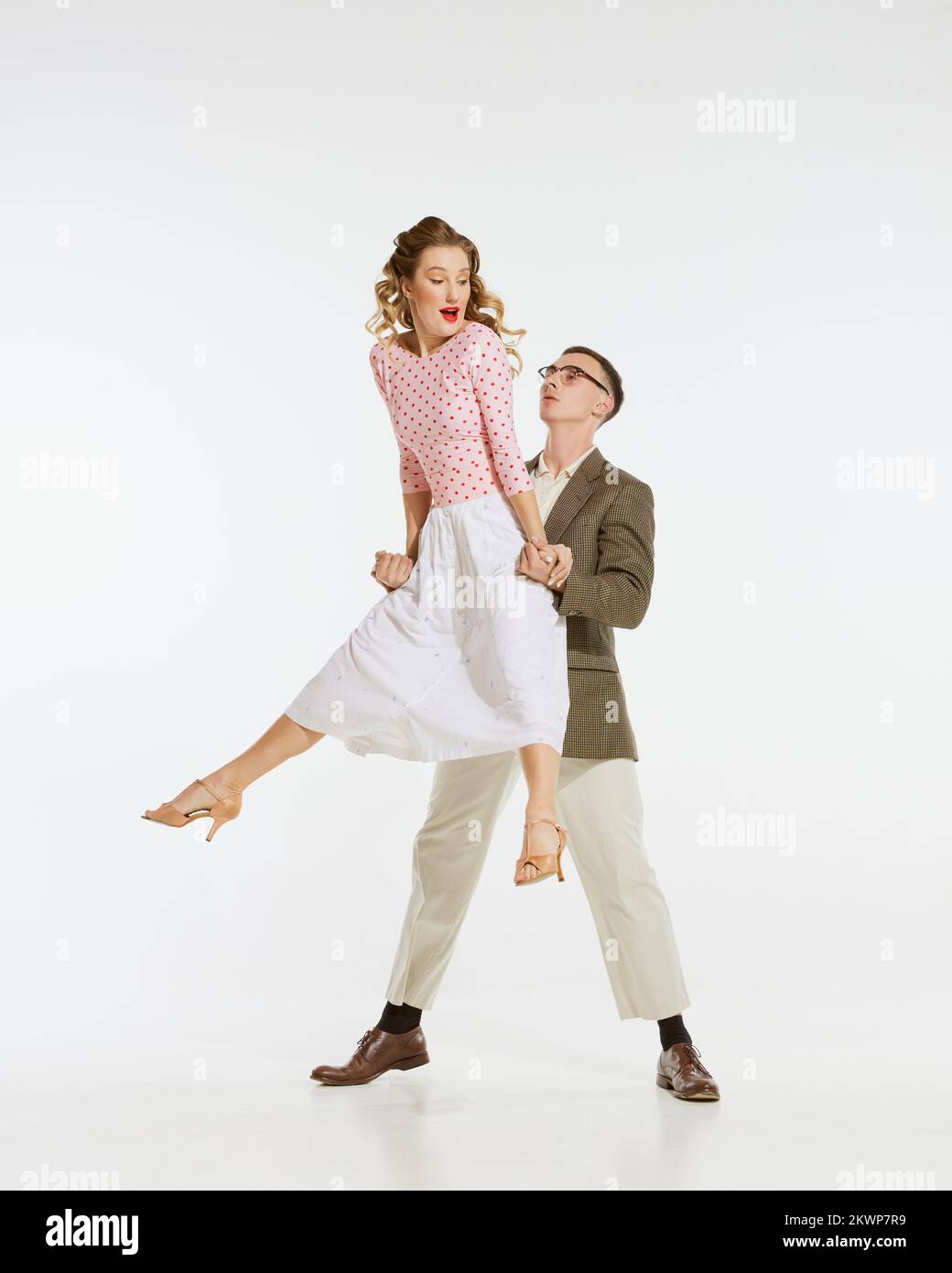 Young excited man and woman in 60s american fashion style clothes ...