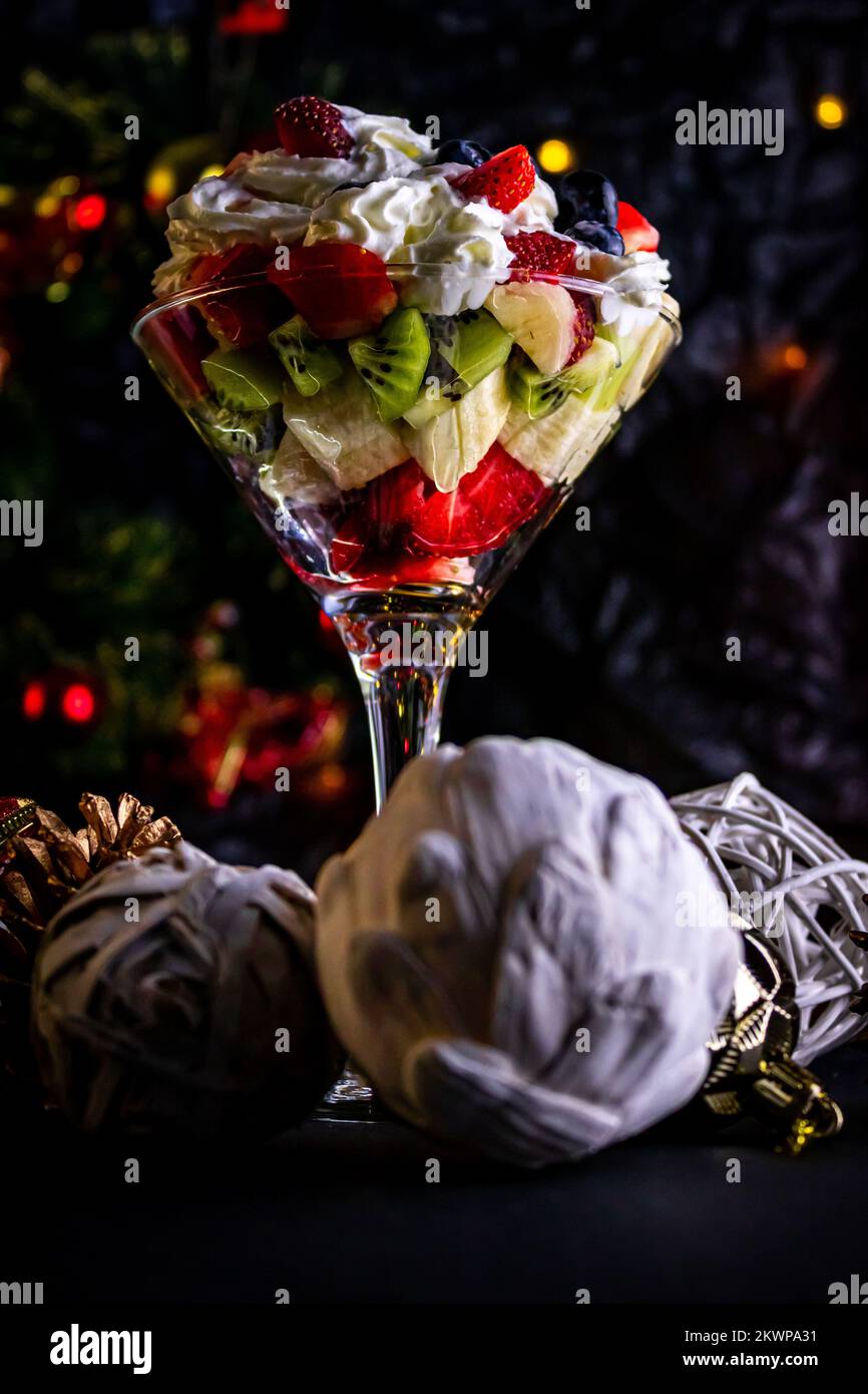 fruit salad in a beautiful glass decorated with cream Stock Photo - Alamy