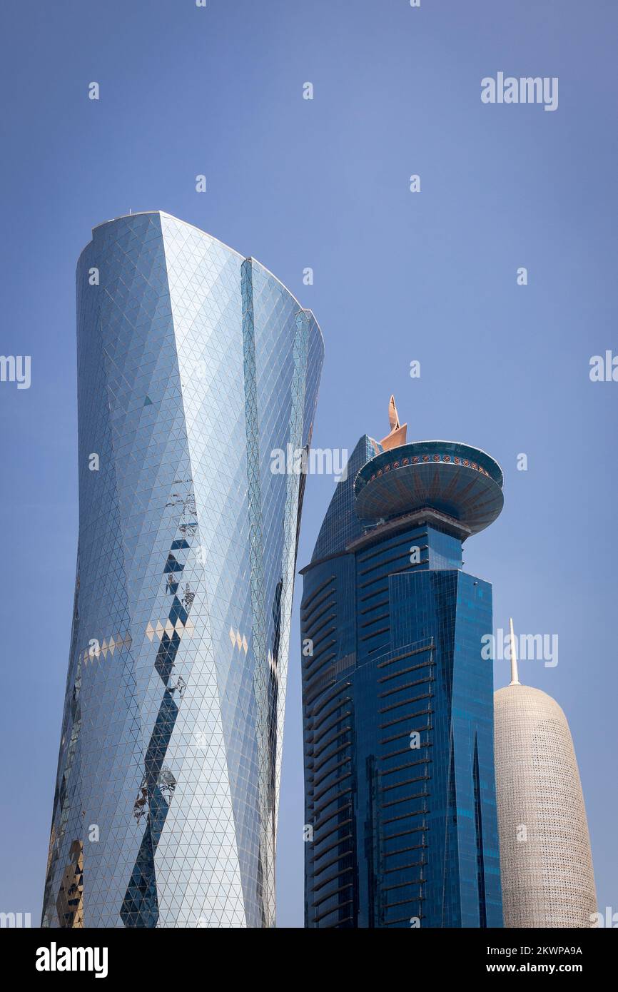 Tall skyscrapers on a clear blue day located in Qatar, Doha Stock Photo ...