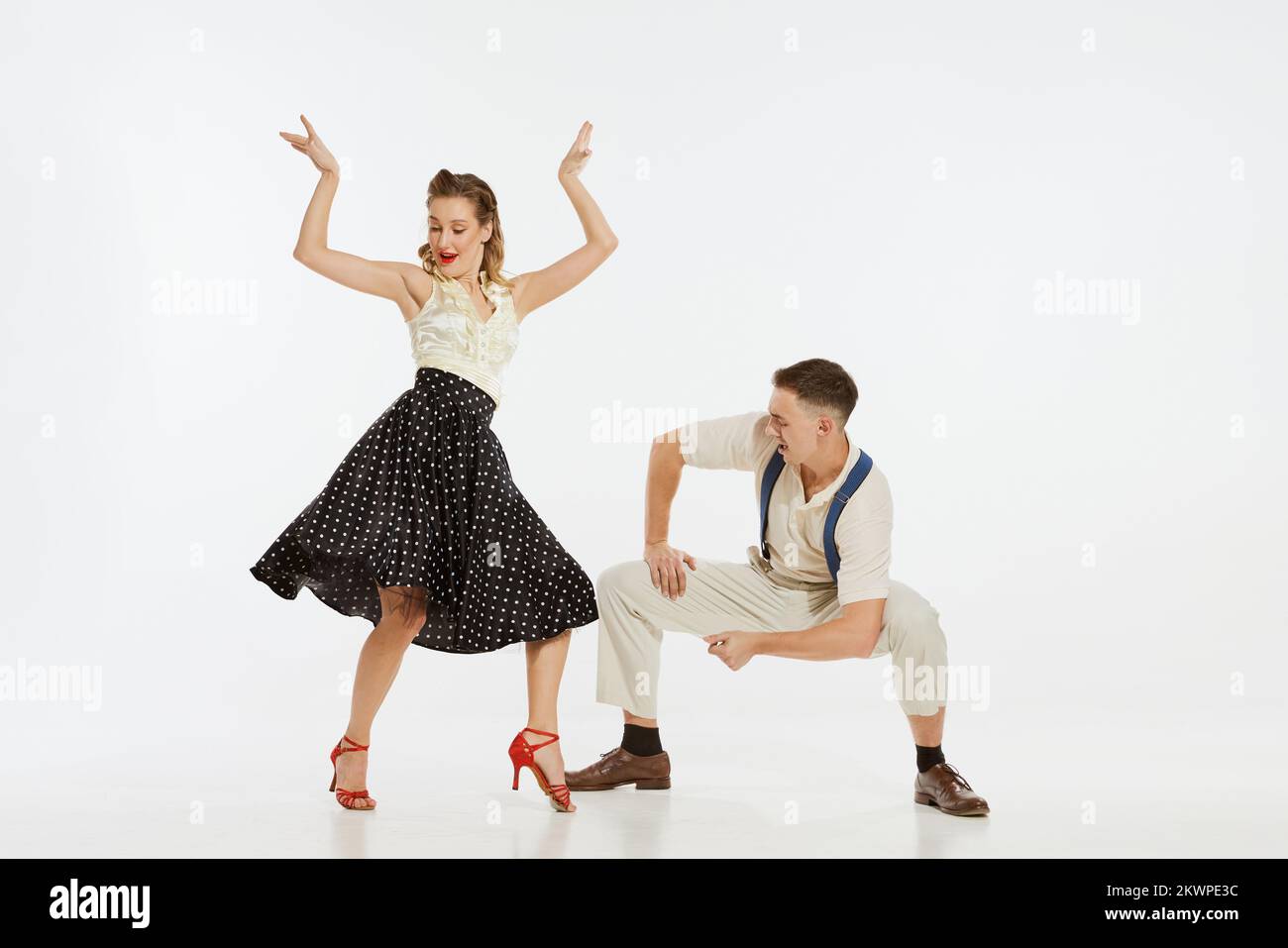 Two emotional dancers in vintage style clothes dancing swing dance ...