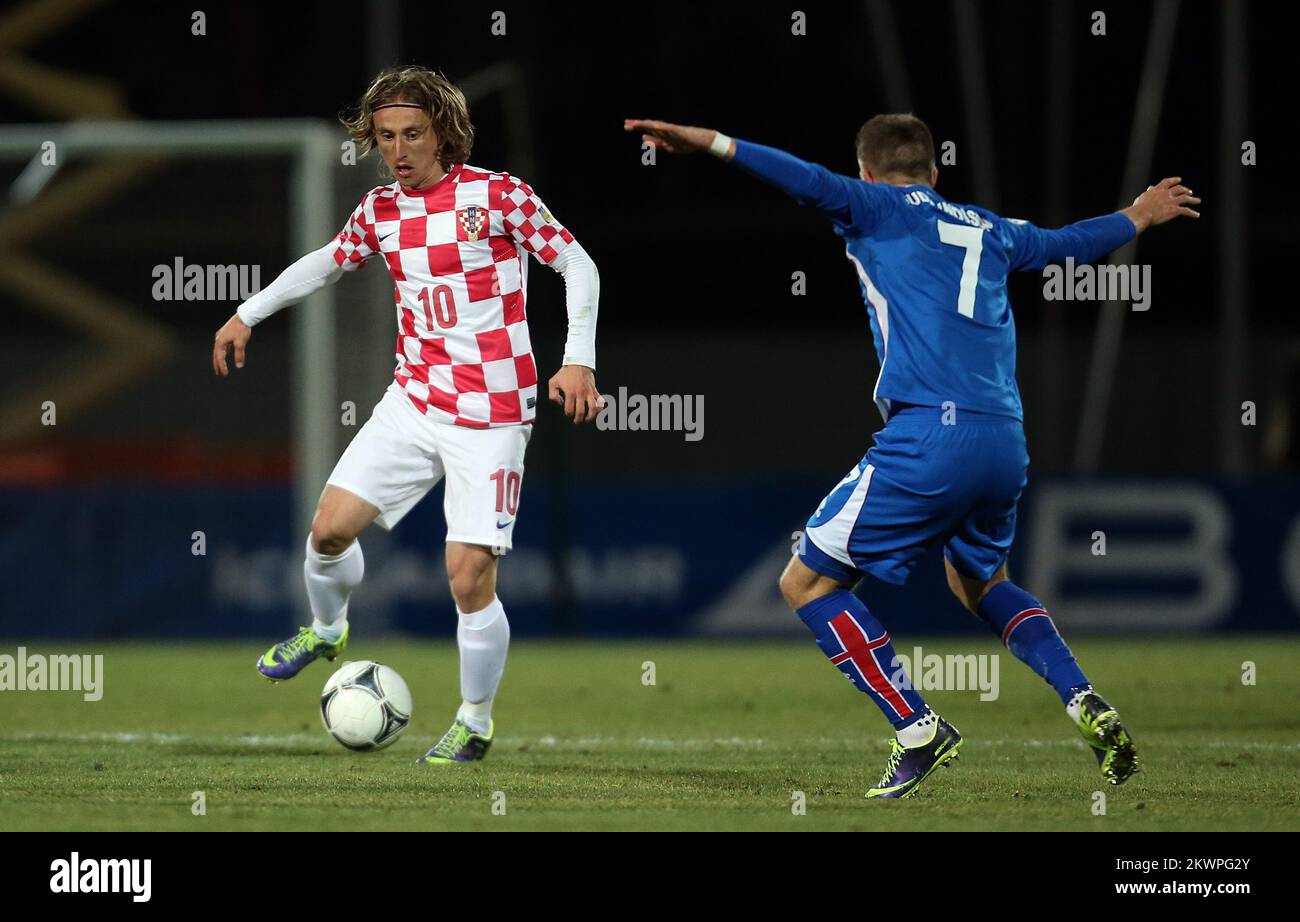 Croatia's Luka Modric and Iceland's Johann Berg Gudmundsson battle for ...