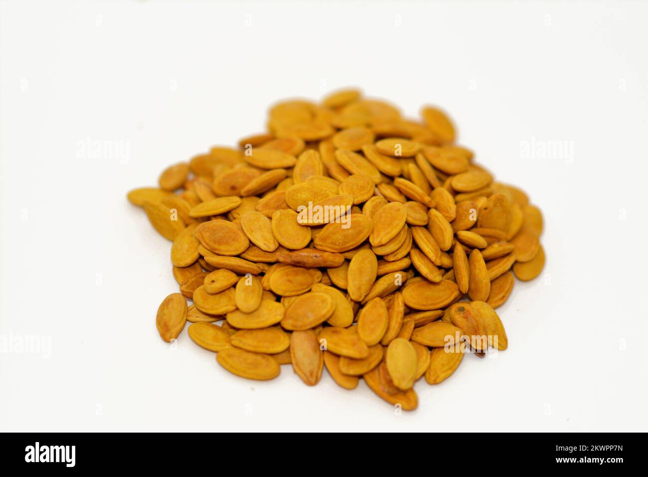 Pile of roasted unpeeled salty Citrullus lanatus watermelon seeds ...