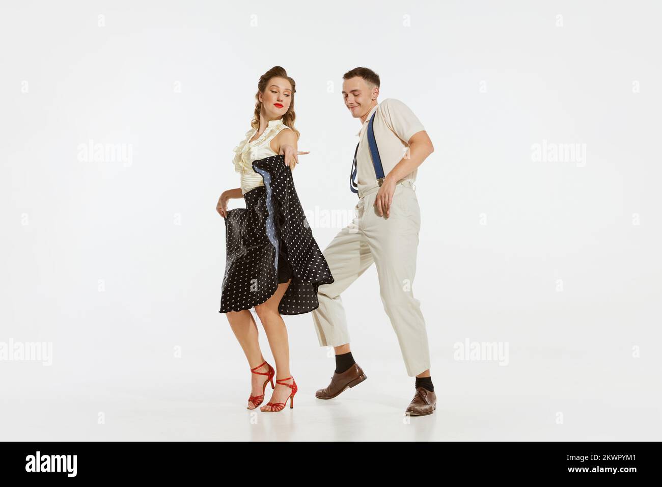 Two emotional dancers in vintage style clothes dancing swing dance ...