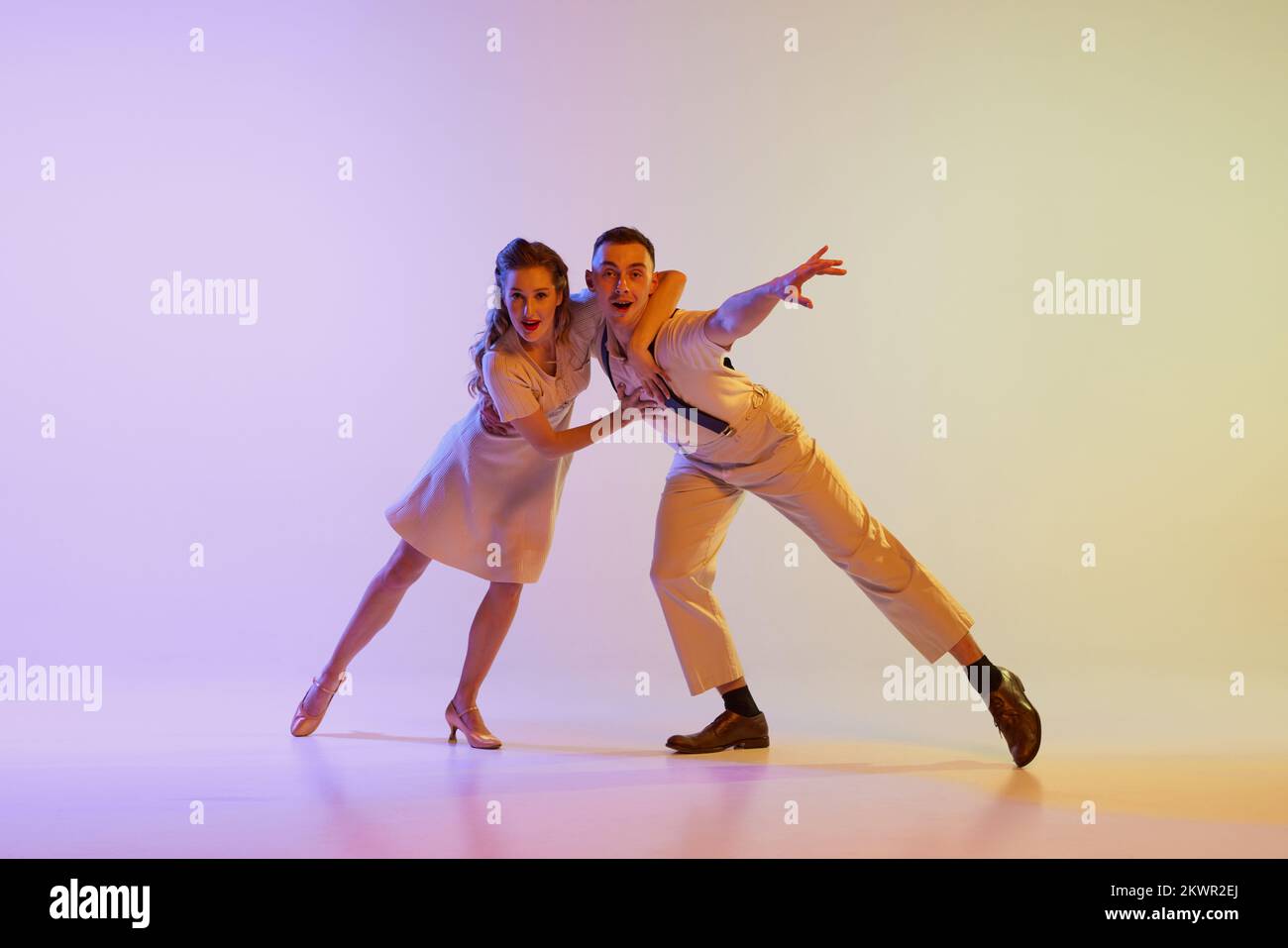 Incendiary dance. Emotional couple of dancers in retro style outfits dancing social dances ...