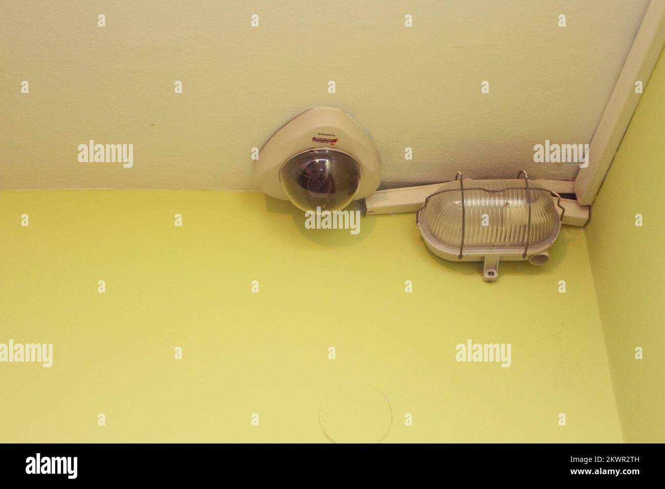 The surveillance camera in the hallway near the front door of the ...