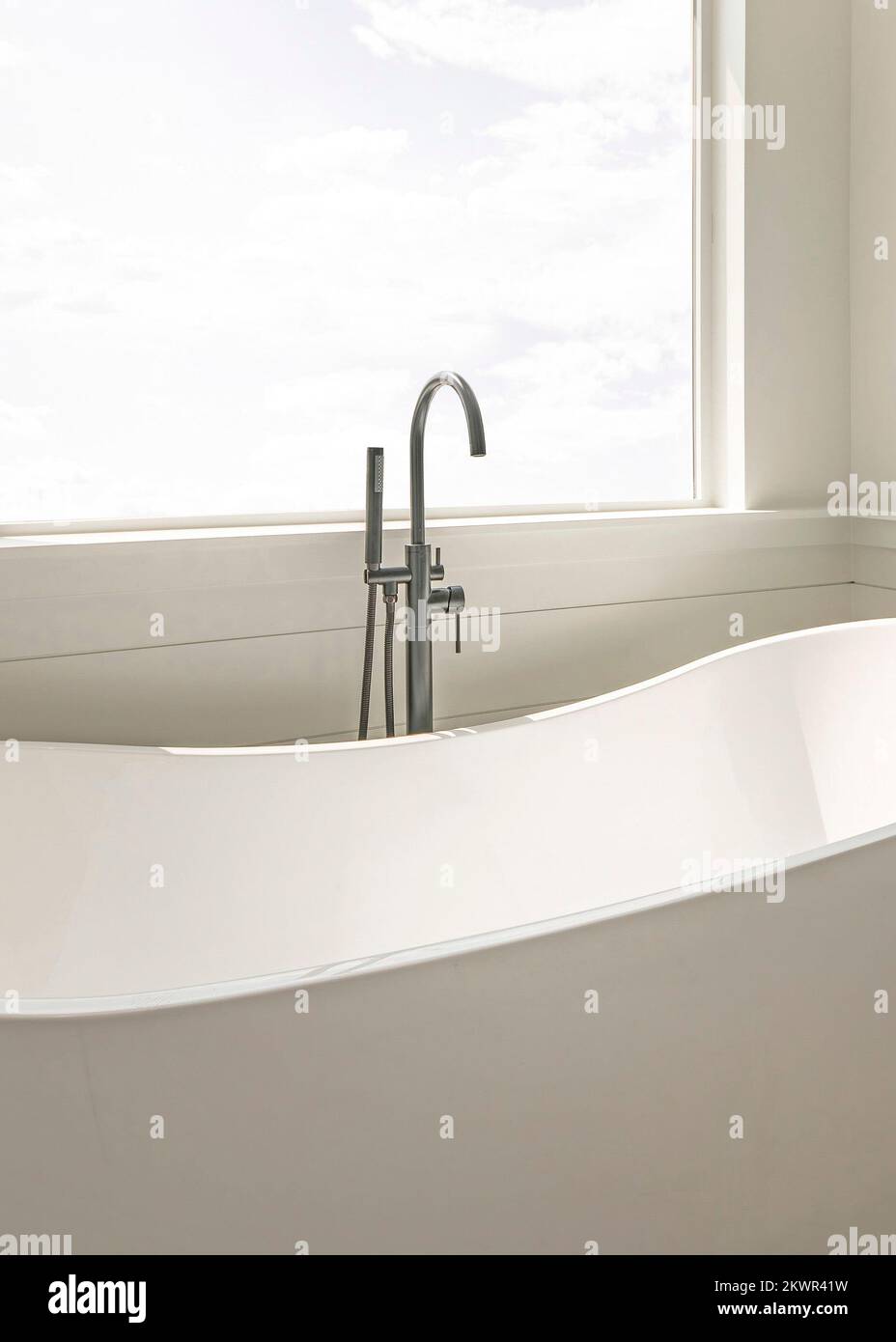 Vertical Modern solid base freestanding tub with floor mount dual ...