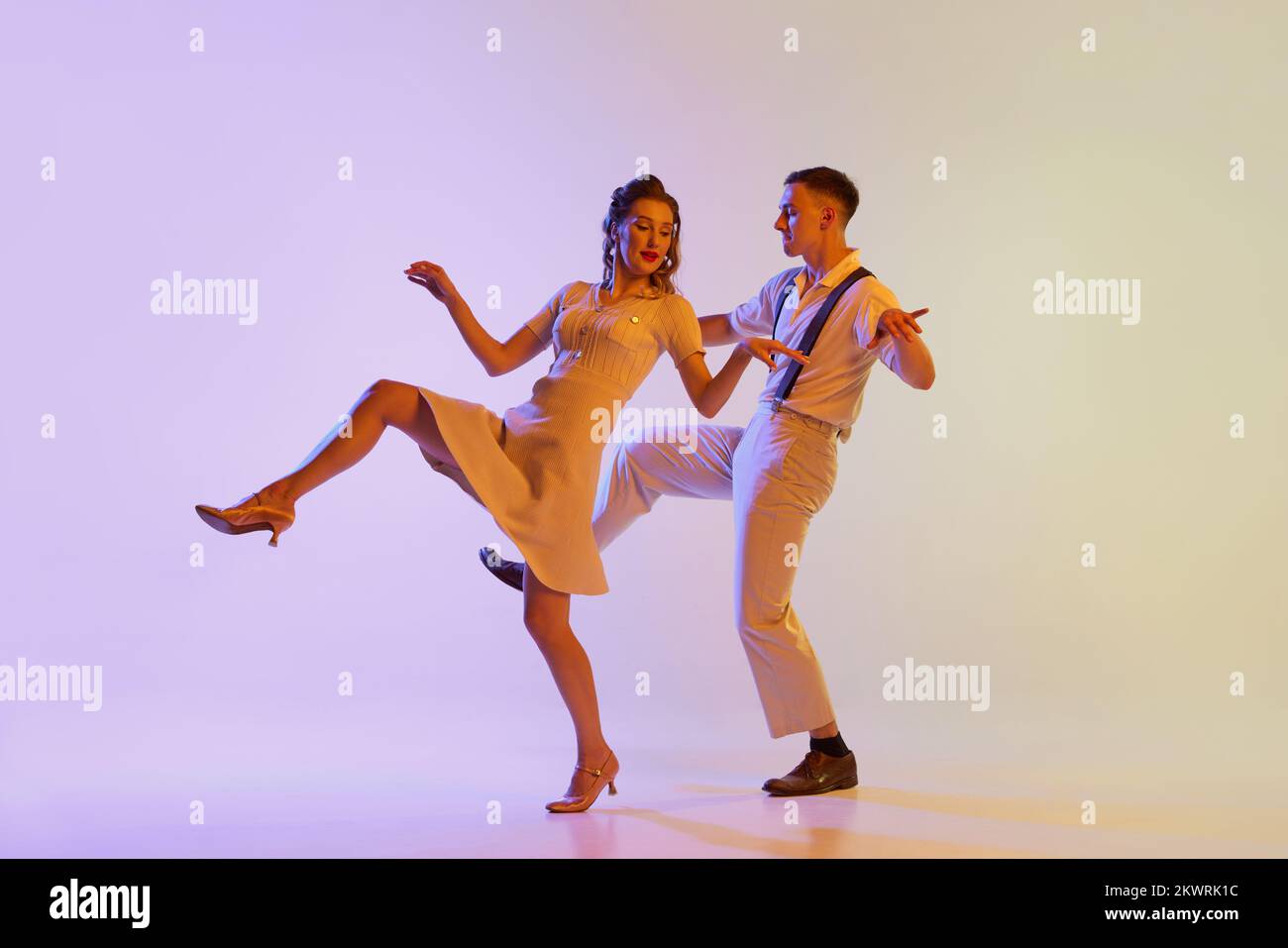 Incendiary dance. Emotional couple of dancers in retro style outfits dancing social dances ...