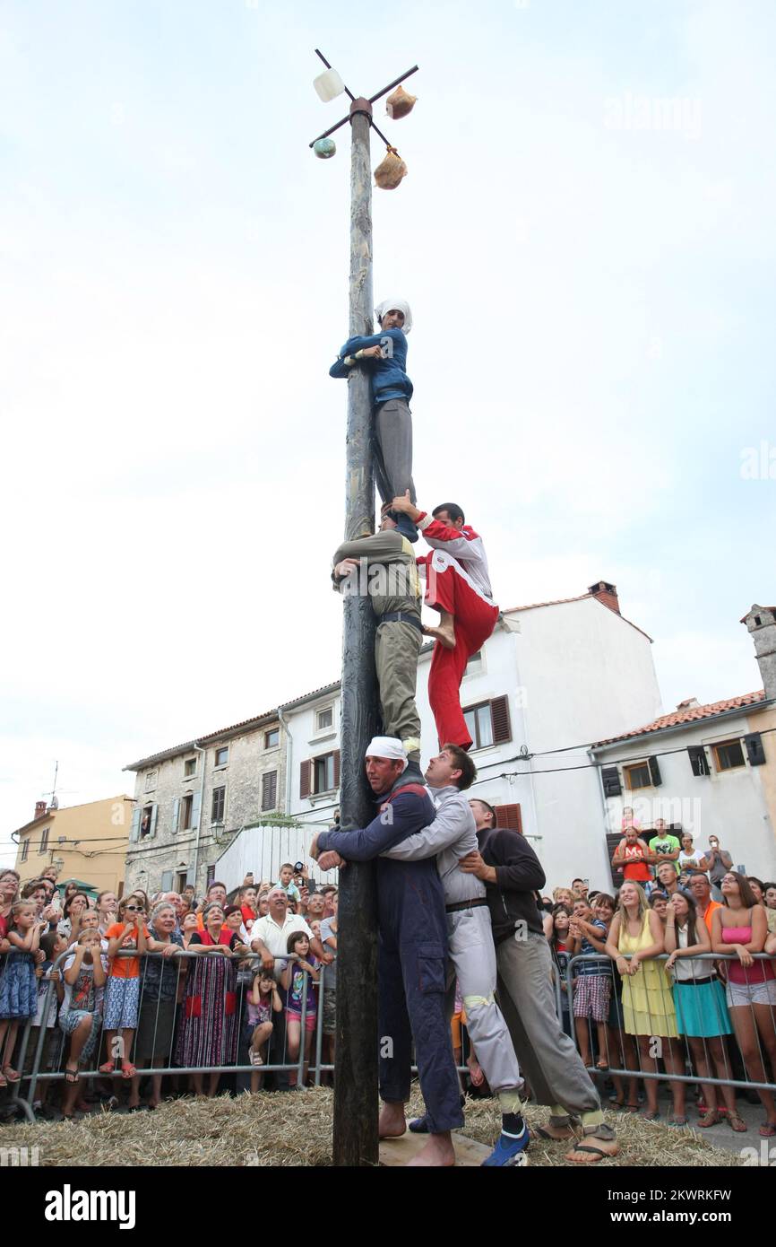 Climbing the greasy pole hi-res stock photography and images - Alamy