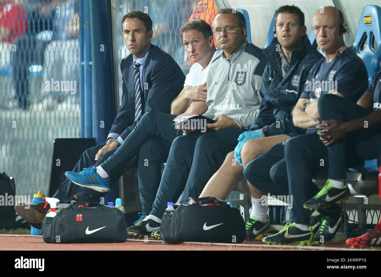 England manager Gareth Southgate (left) with his staff on the bench ...