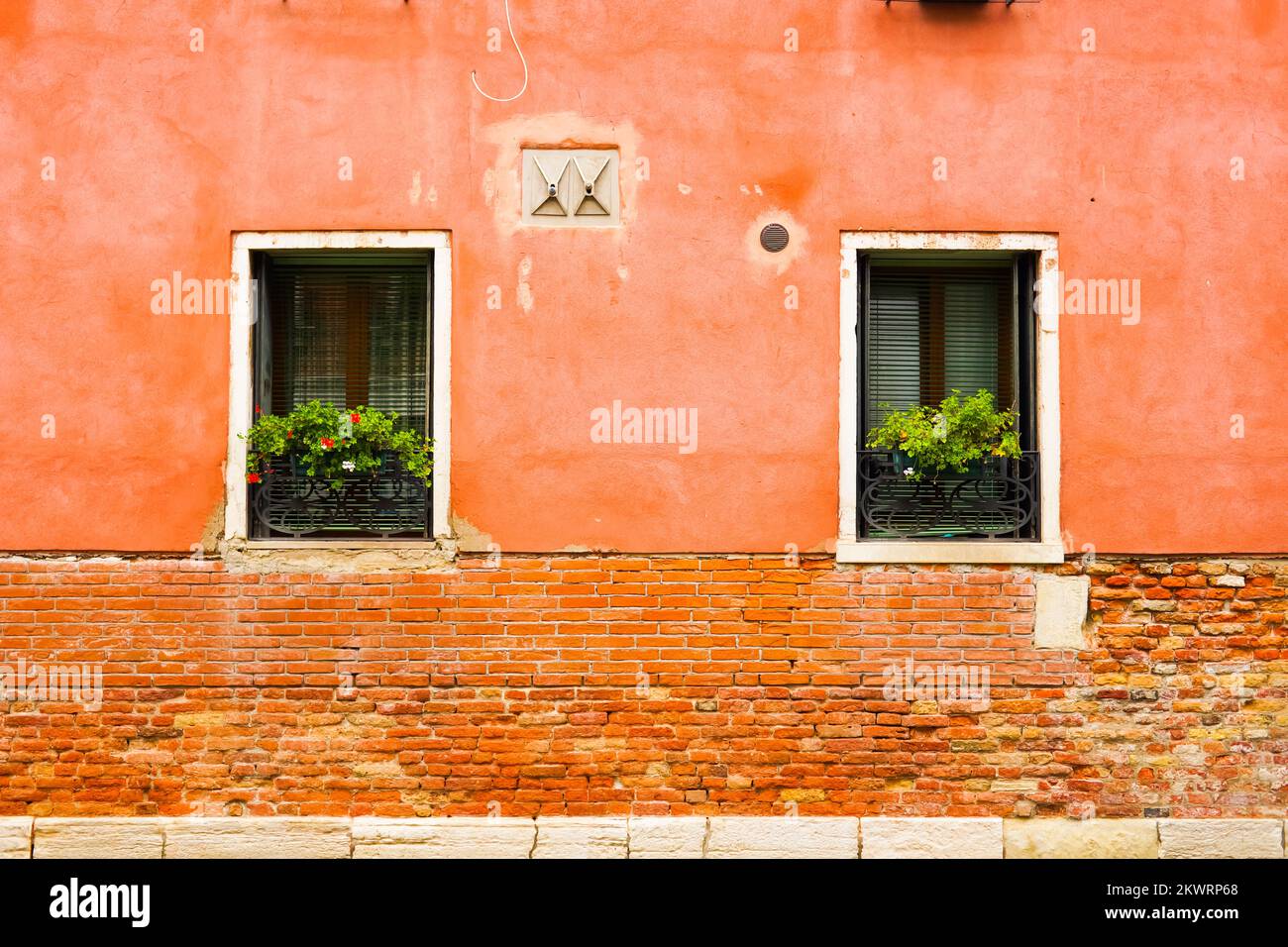 Close up shot of building with red wall Stock Photo - Alamy