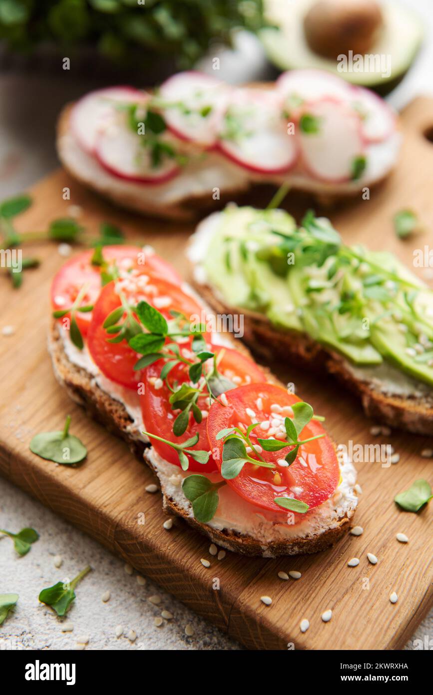 Different sandwiches with vegetables and microgreens. Healthy food ...