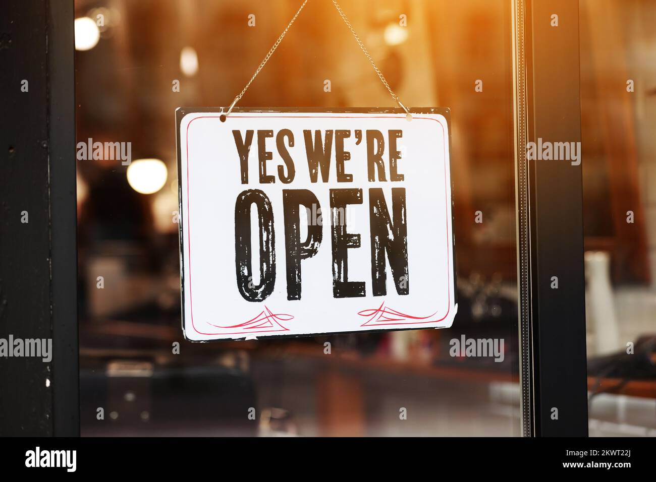 Inscription Yes we're open metal plate with black and white sign on ...