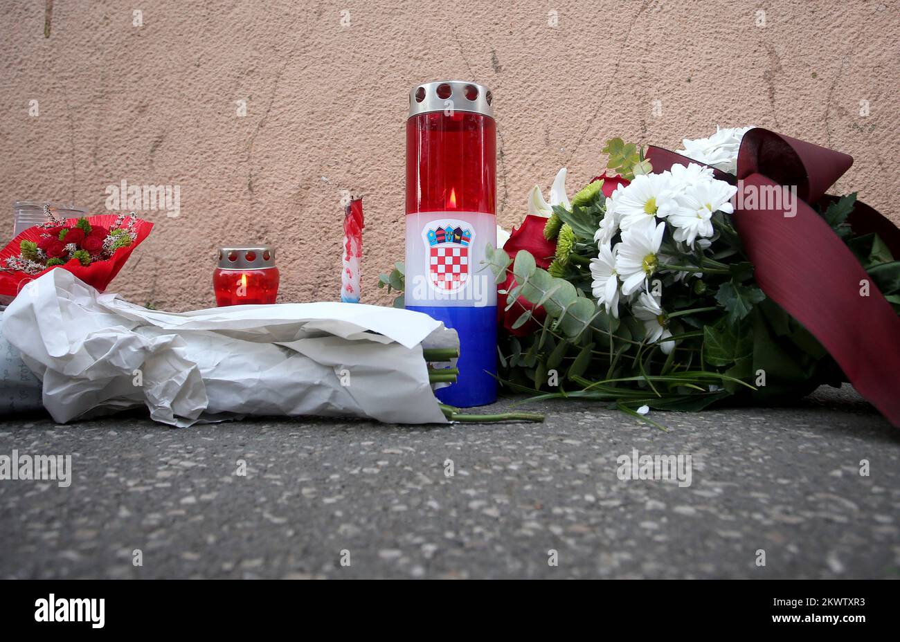 14.11.2015., Zagreb, Croatia - People put flowers and candles around ...
