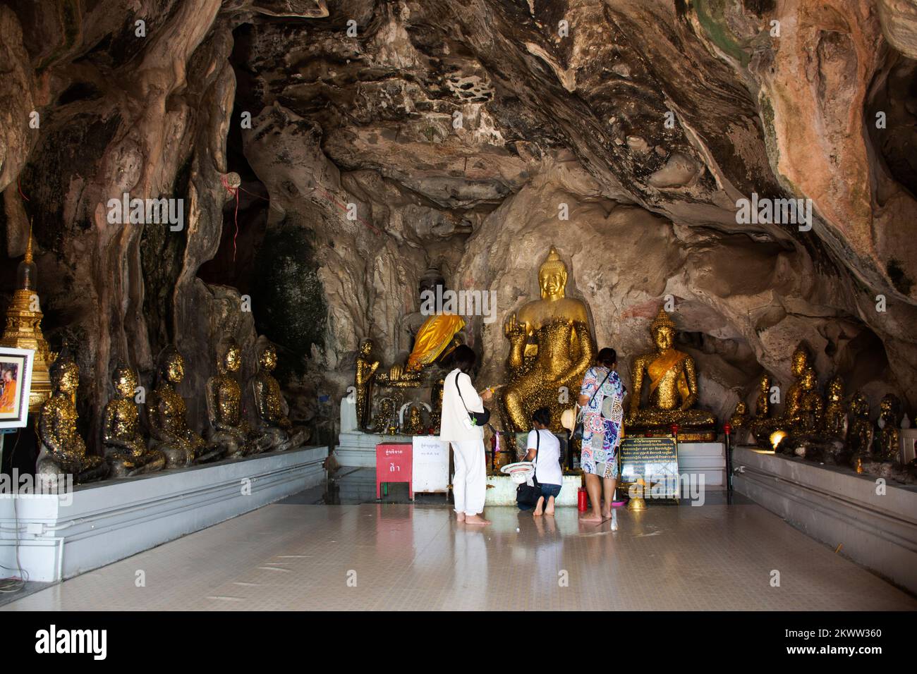 Carving stone and sculpture buddha image statue on cave wall for thai people travel visit ...