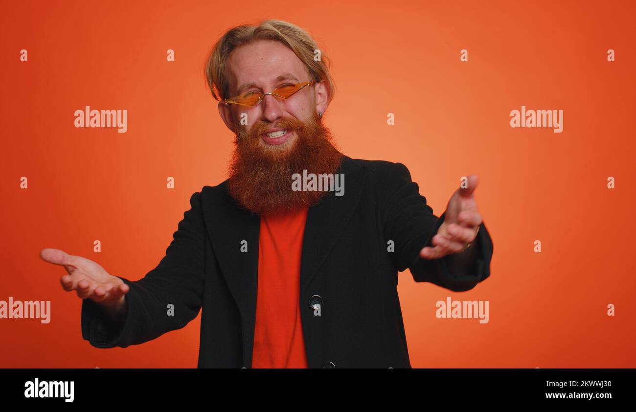 Upset disappointed redhead bearded man wipes tears and cries from ...