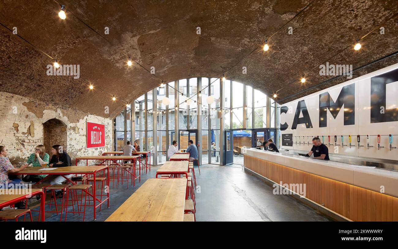 Seating inside of railway arches. Camden Town Beer Hall, London, United ...