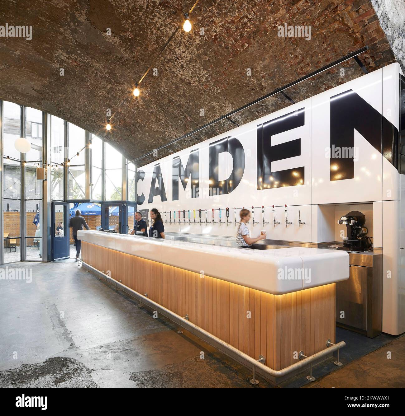 Bar counter with multiple taps and view through to mews. Camden Town ...