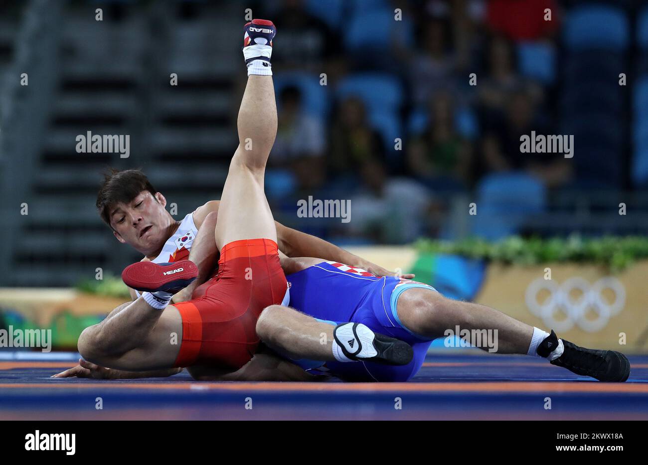 Bozo Starcevic of Croatia competes against Kim Hyeon-Woo of Korea ...