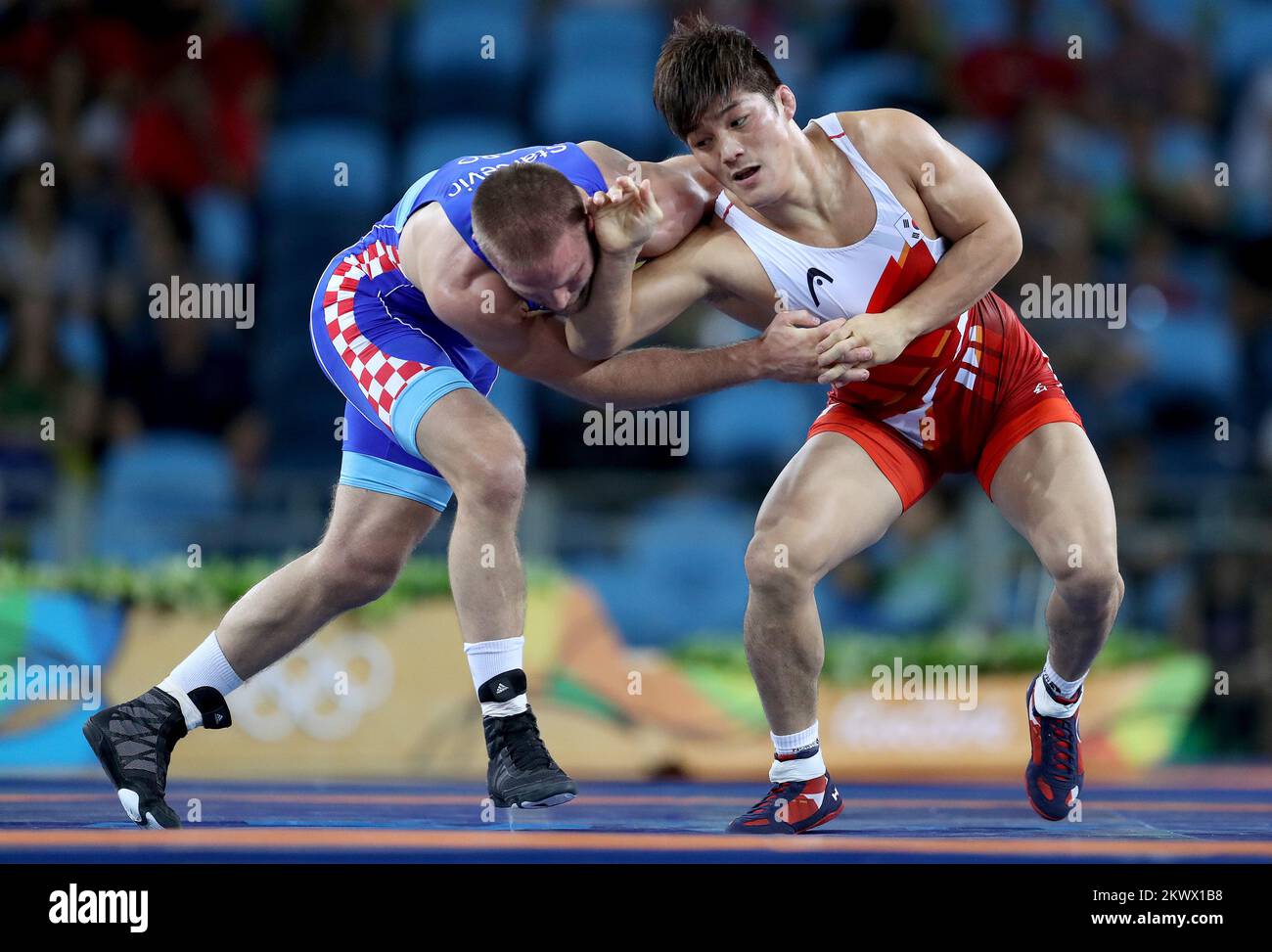 Bozo Starcevic of Croatia competes against Kim Hyeon-Woo of Korea ...
