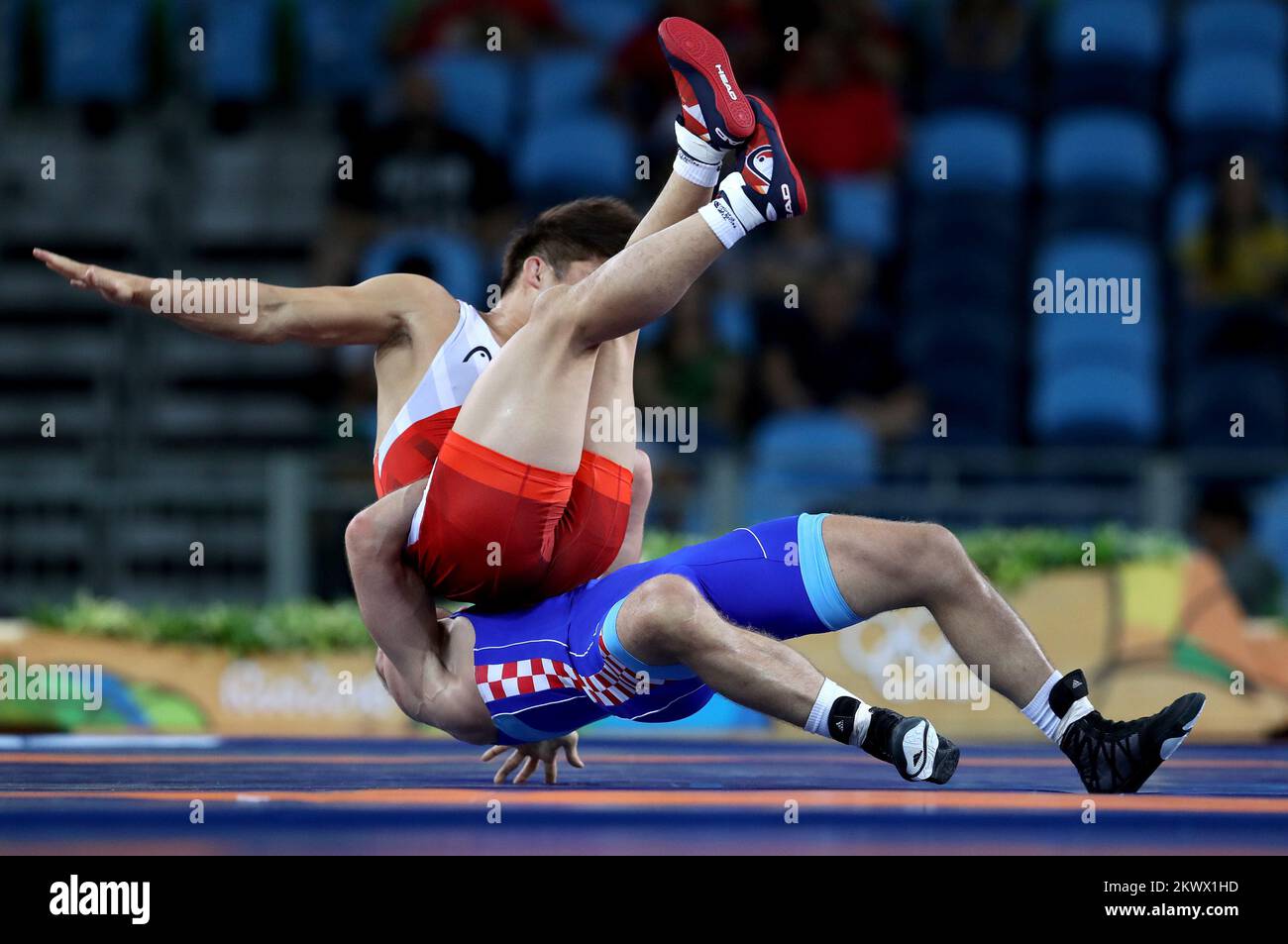 Bozo Starcevic of Croatia competes against Kim Hyeon-Woo of Korea ...
