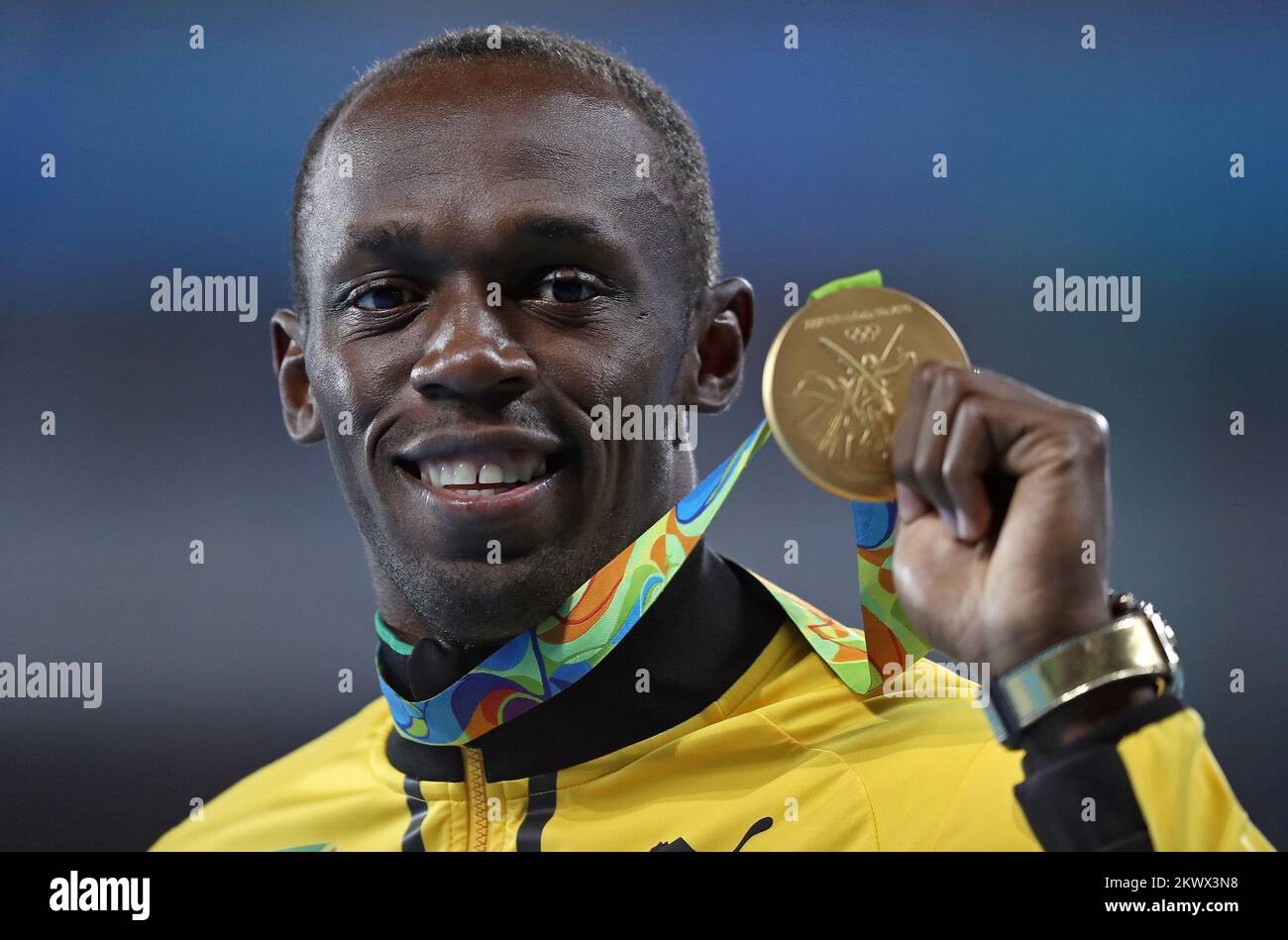 Usain Bolt of Jamaica pose with gold medal after the men's 200 metres ...