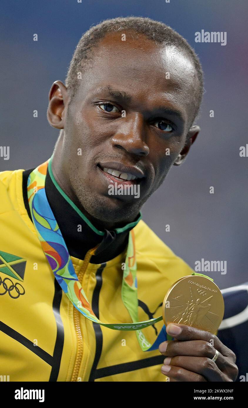 Usain Bolt of Jamaica pose with gold medal after the men's 200 metres ...
