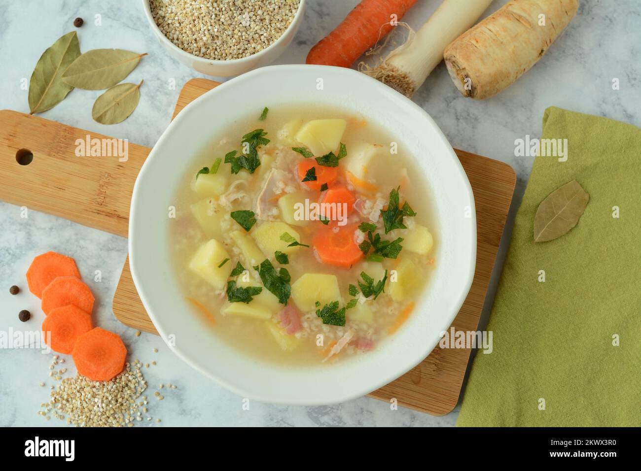 Krupnik, traditional Polish barley soup with vegetables in a bowl Stock ...